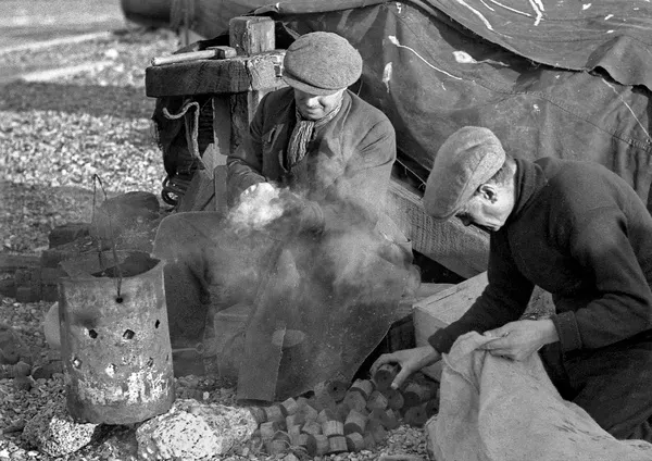 Two men sitting by a smoking brazier Our beautiful Wall Art and Photo ...