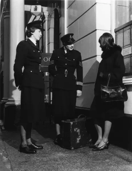 Two women police officers and woman with suitcase Our beautiful Wall ...